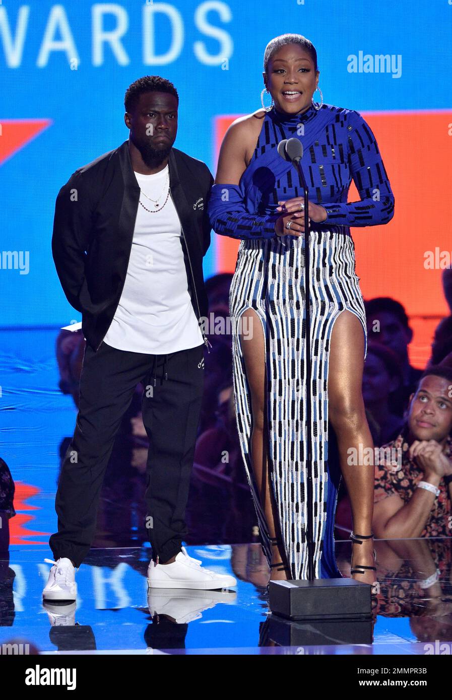 Kevin Hart, left, and Tiffany Haddish present the award for best hip ...