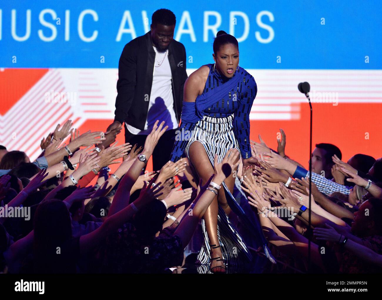 Kevin Hart, left, and Tiffany Haddish present the award best hip-hop ...