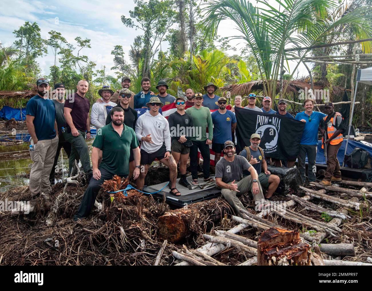 Personnel assigned to the Defense POW/MIA Accounting Agency (DPAA) pose ...