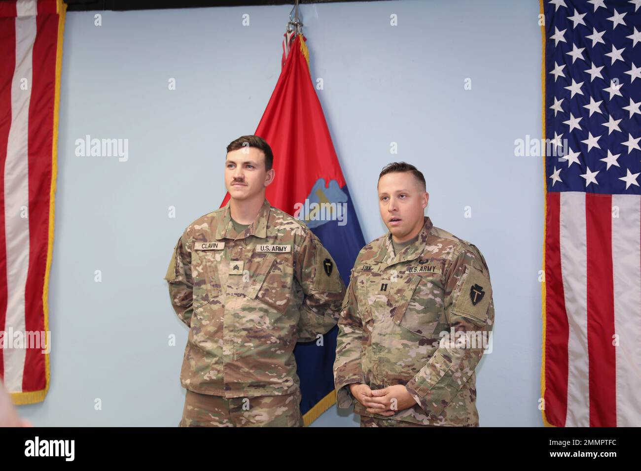 U.S. Army Capt. Cory Finn (right), commander of Headquarters and ...