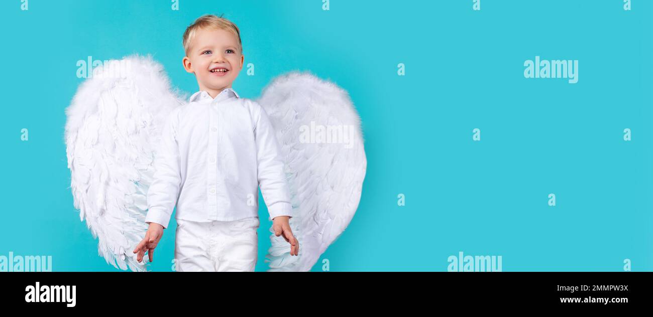 Angel child banner, isolated studio background. Smiling little boy kid ...