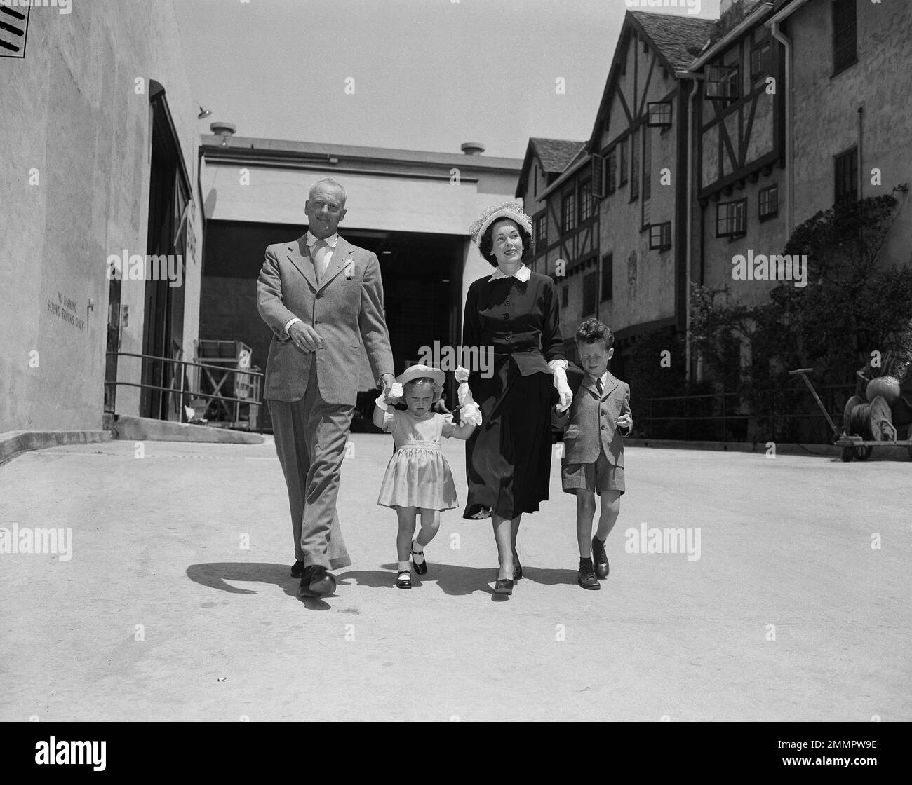 Film director John Farrow and his wife, actor Maureen O'Sullivan, walk ...