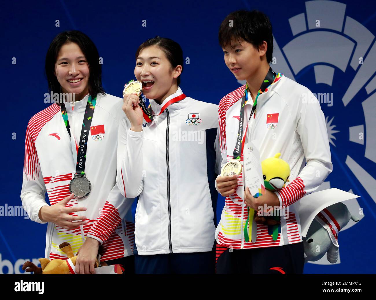 Women's 100m freestyle gold medalist Japan's Rikako Ikee, centre ...