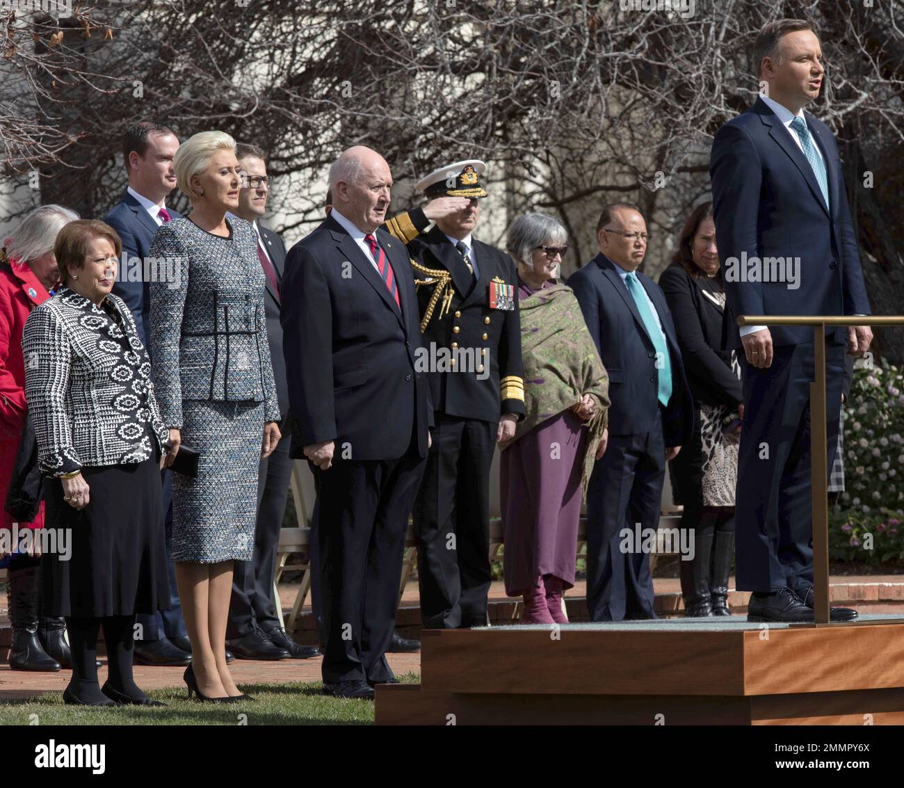 Polish President Andrzej Duda, right, stands on a dais as his wife ...