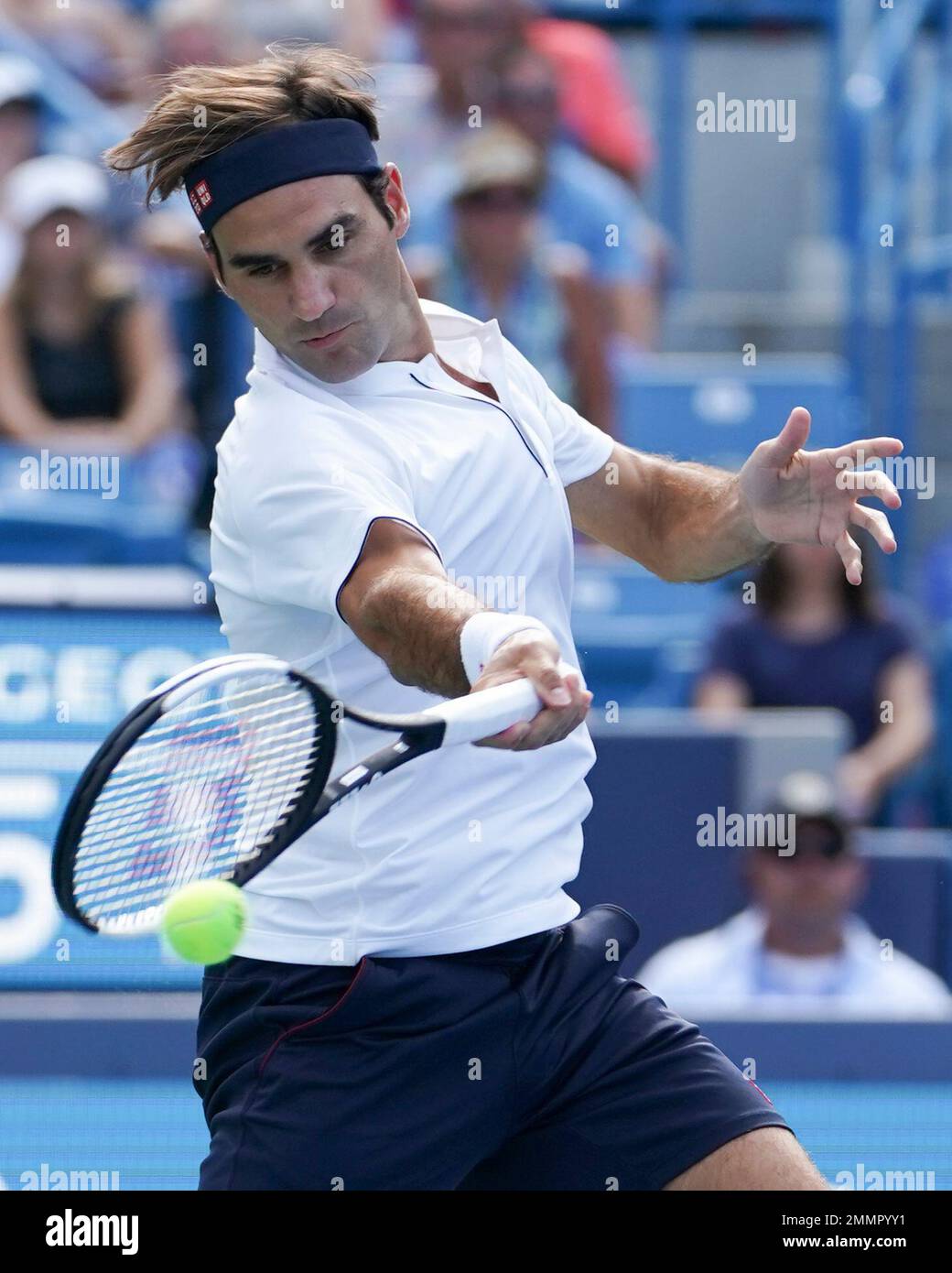 Roger Federer, of Switzerland, returns to Novak Djokovic, of Serbia ...