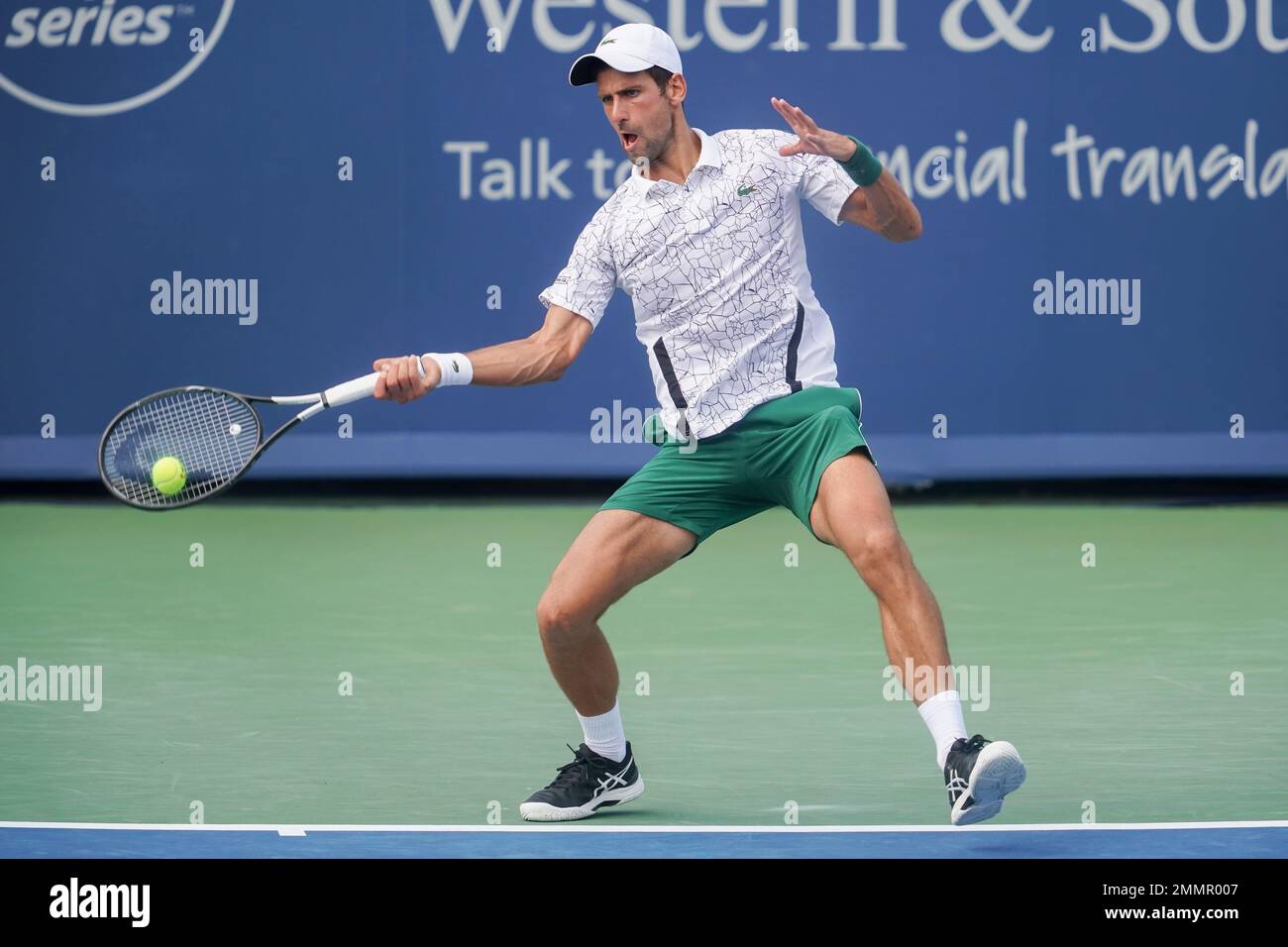 Novak Djokovic, of Serbia, returns to Roger Federer, of Switzerland ...