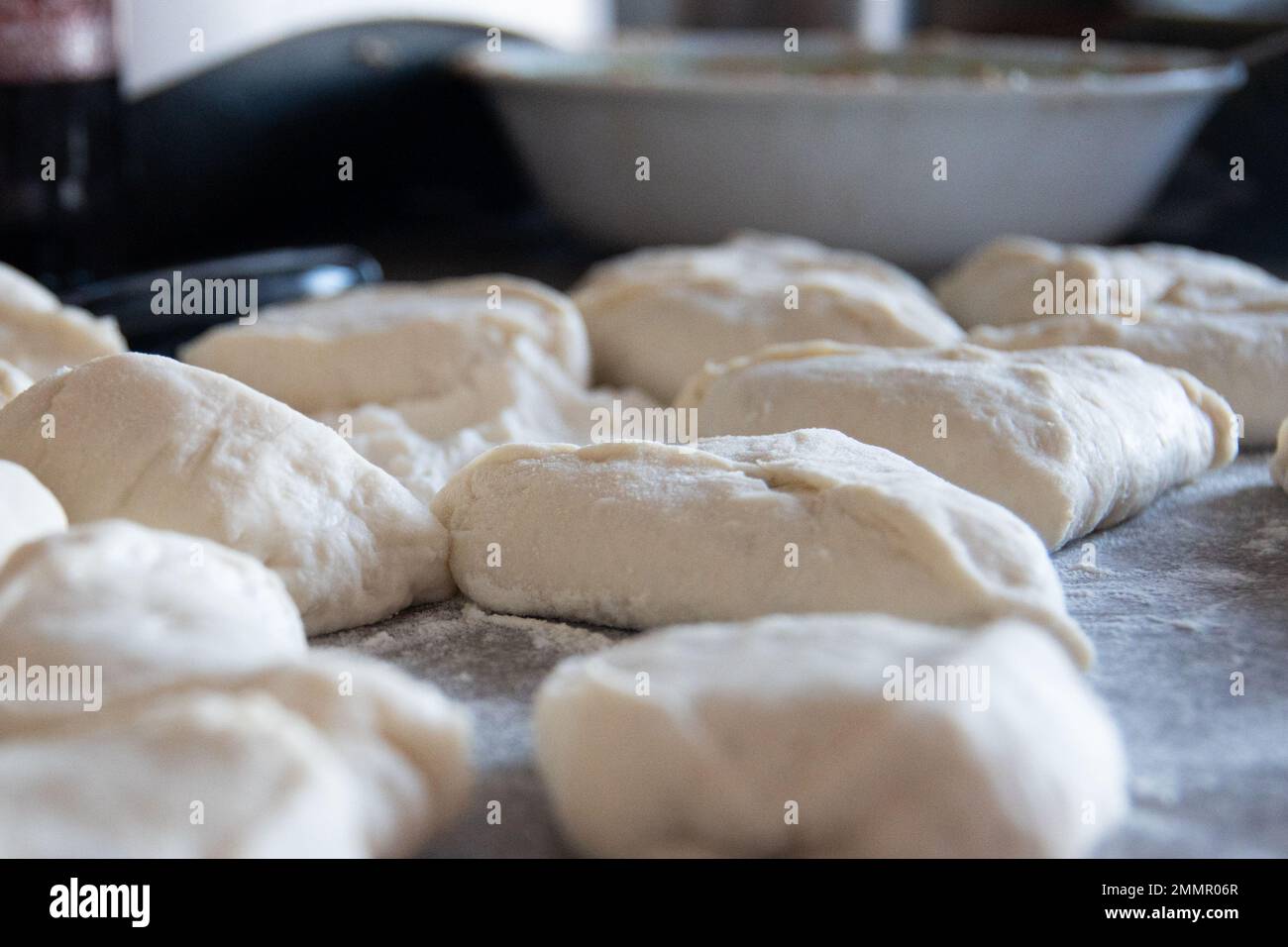 Cooking meat pies from dough using flour. Side view. Traditional ...