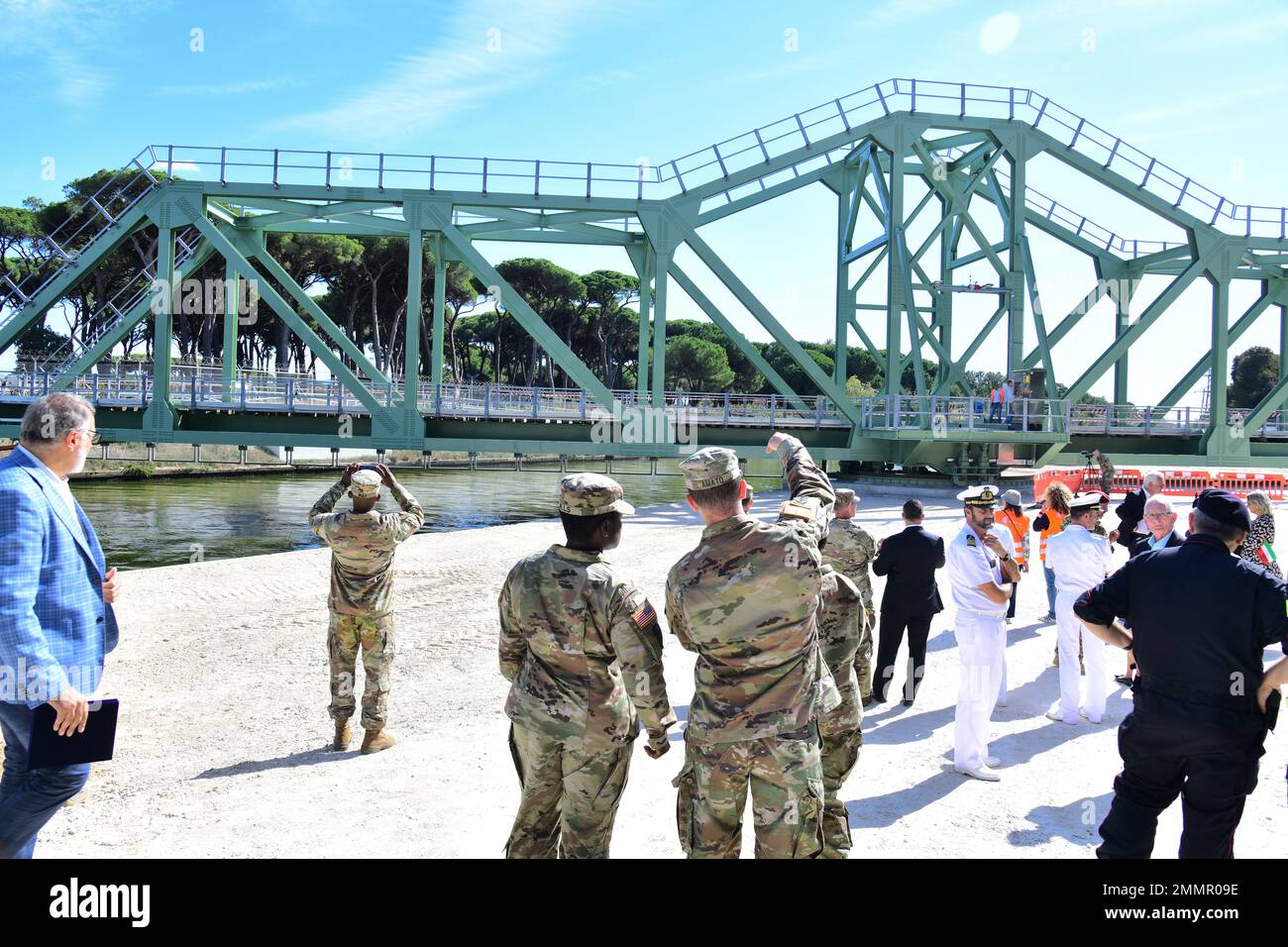 The guests watch the revolving bridge in operation, after the ribbon ...