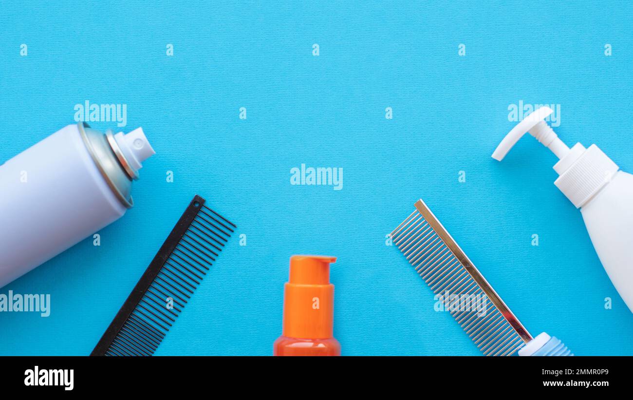 Classic grooming and hairdressing tools on a blue background: varnish ...