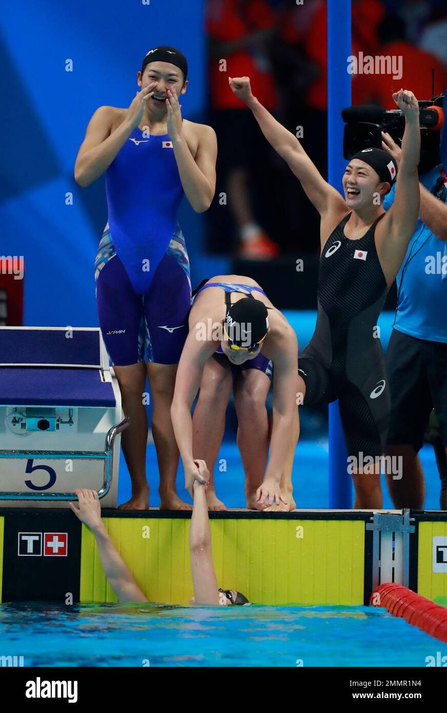 The Japanese team celebrates after winning the women's 4 x 100m ...