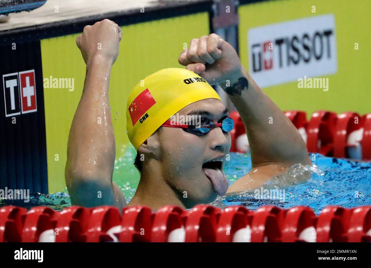 China's Xu Jiayu celebrates after winning the men's 100m backstroke ...