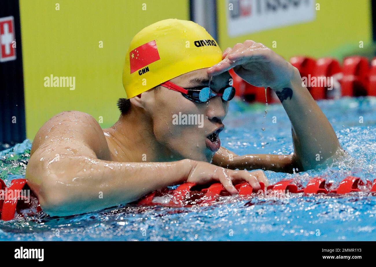 China's Xu Jiayu celebrates after winning the men's 100m backstroke ...