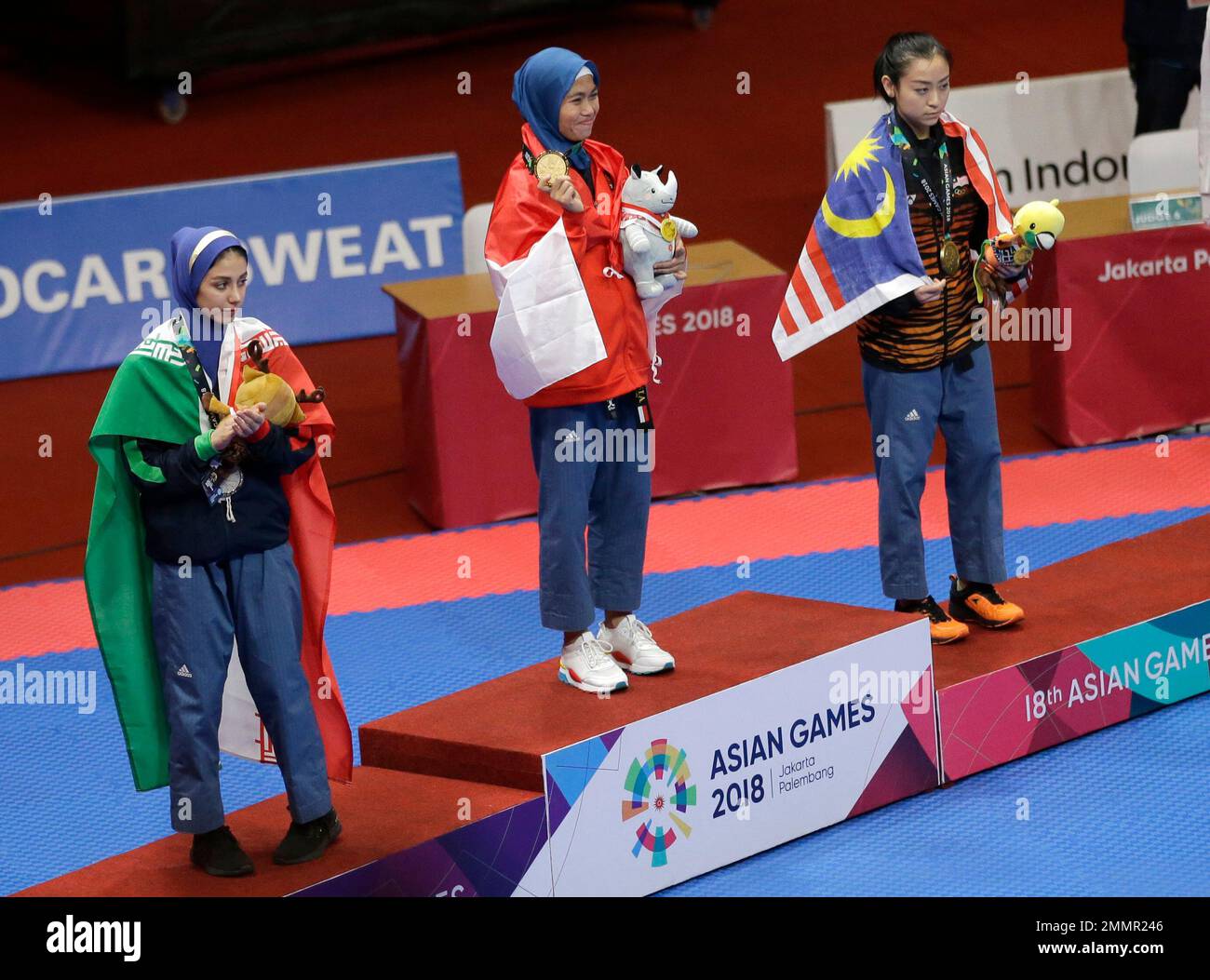 Gold medalist Defia Rosmaniar of Indonesia , center ,Silver medalist ...