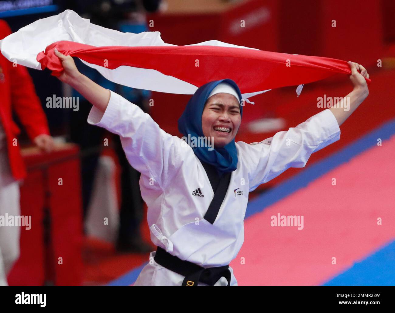 Indonesia's Defia Rosmaniar, celebrates after winning their women ...