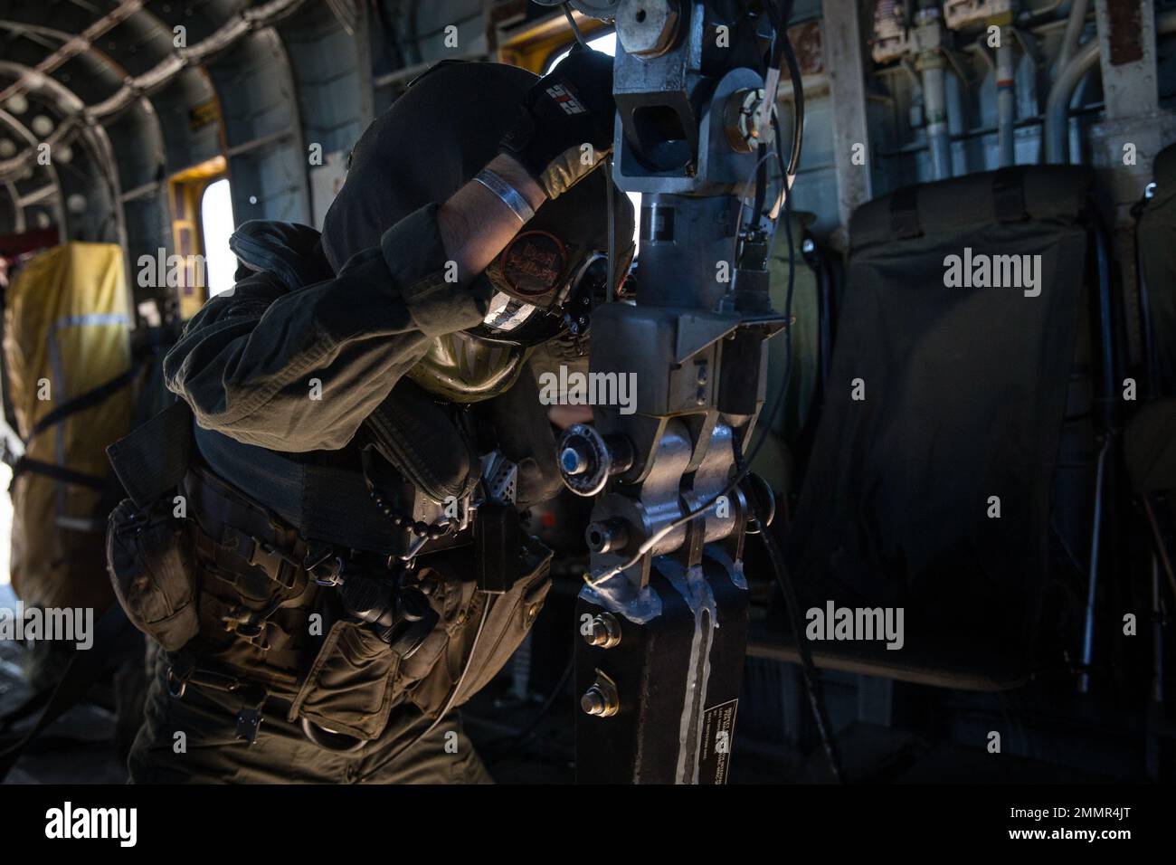 A CH-53E Super Stallion aircrewman flies with the Marine Air-Ground ...