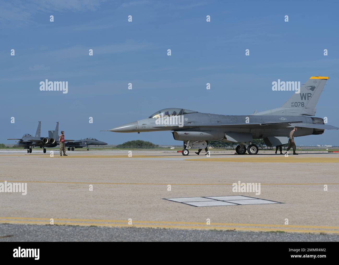 An 80th Fighter Squadron F-16 Fighting Falcon sits on the flightline as ...