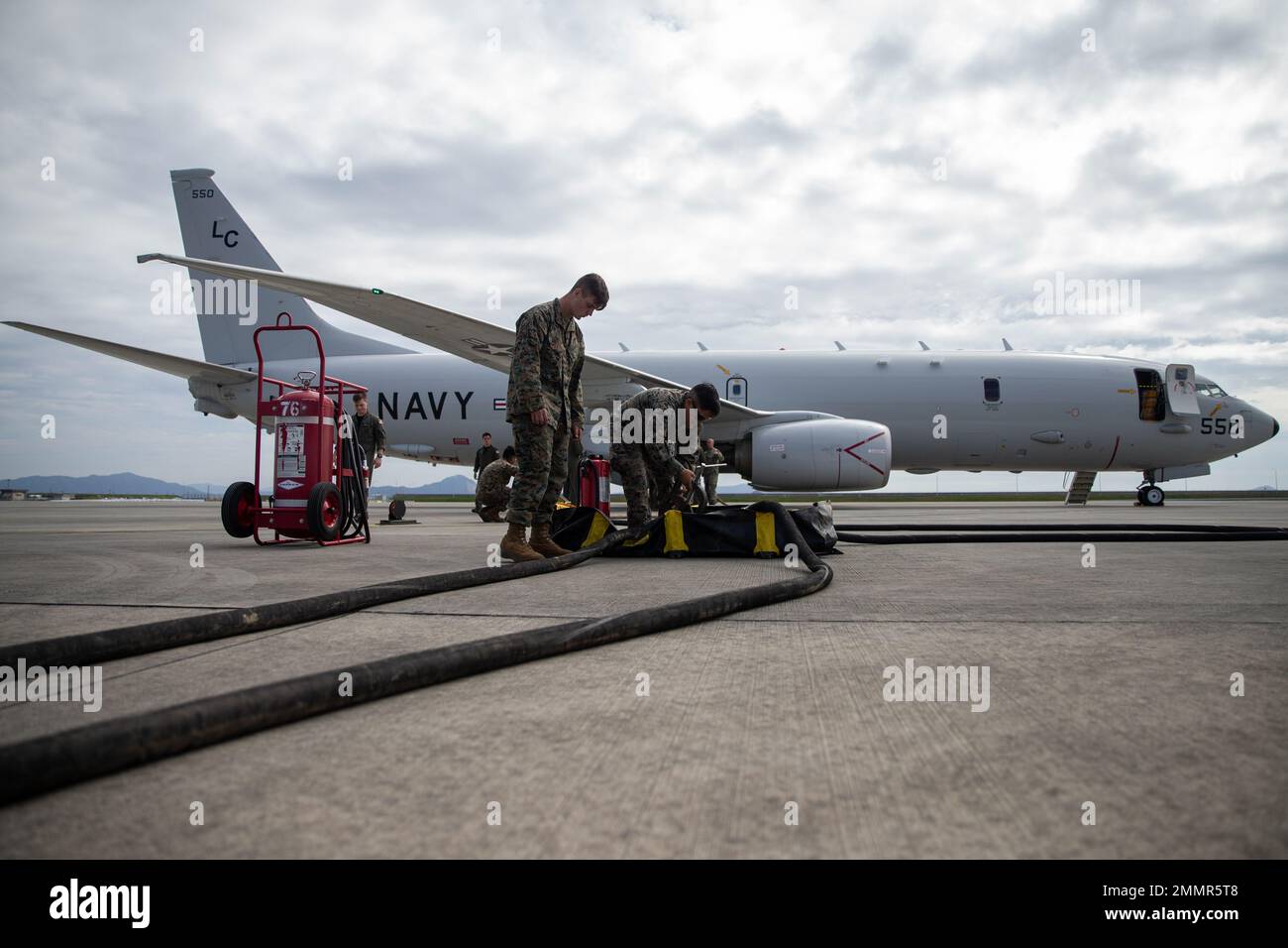 U.S. Marines with Marine Wing Support Squadron (MWSS) 171 refuel a U.S ...
