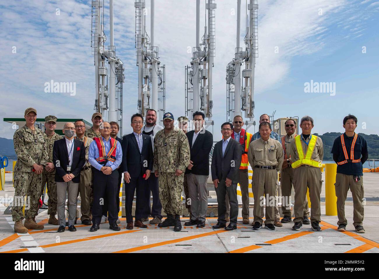 Capt. David Adams, Commander, Fleet Activities Sasebo (CFAS), and representatives from the TOA ...