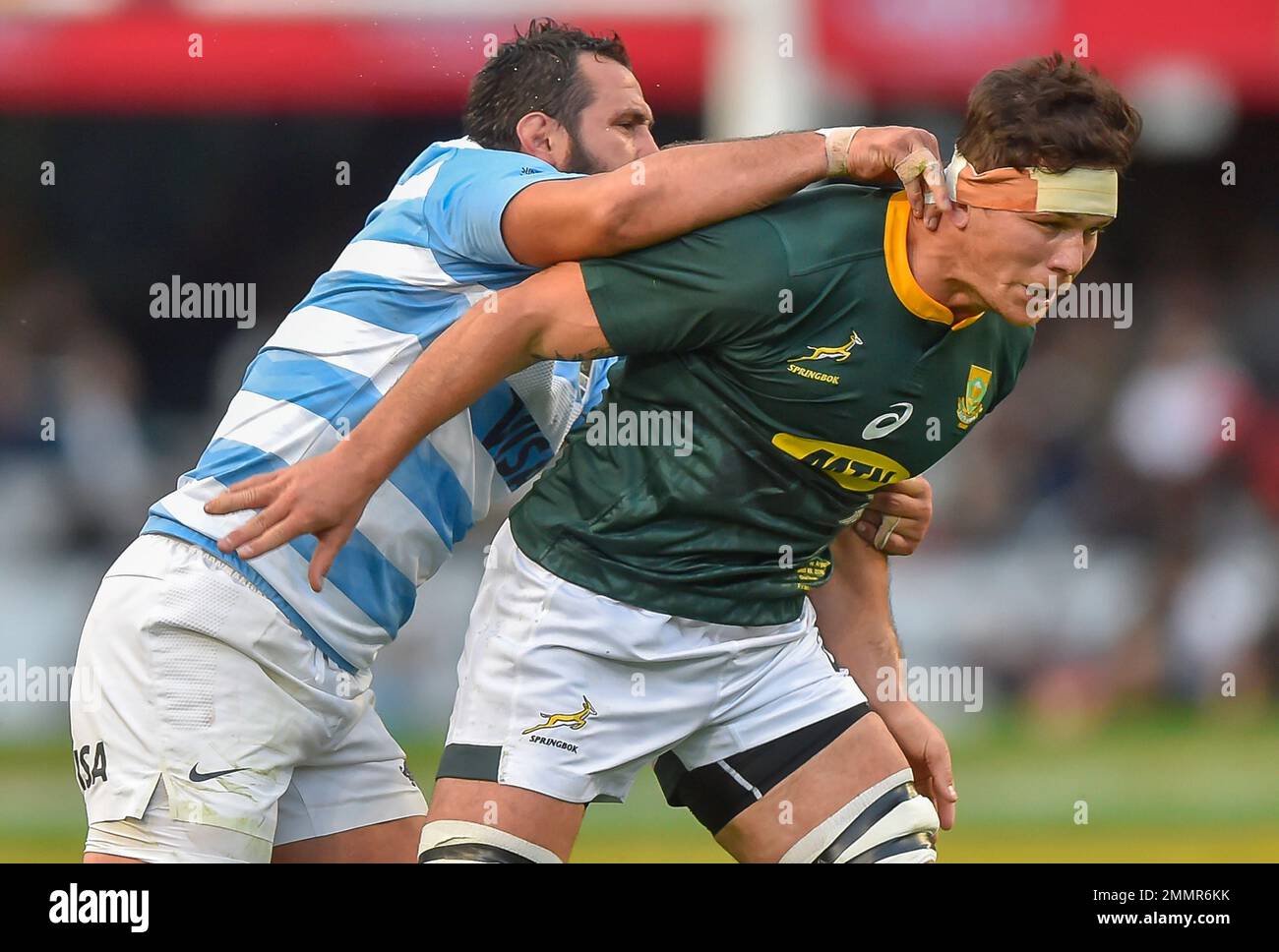 Argentina tight-head prop Juan Figallo, left, tackles South Africa ...