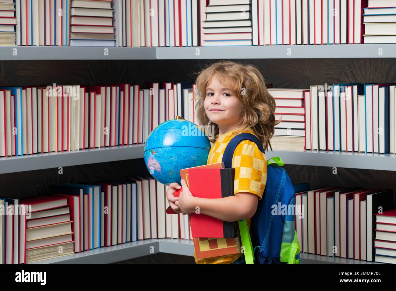 School boy world globe and books. Kid boy from elementary school with ...
