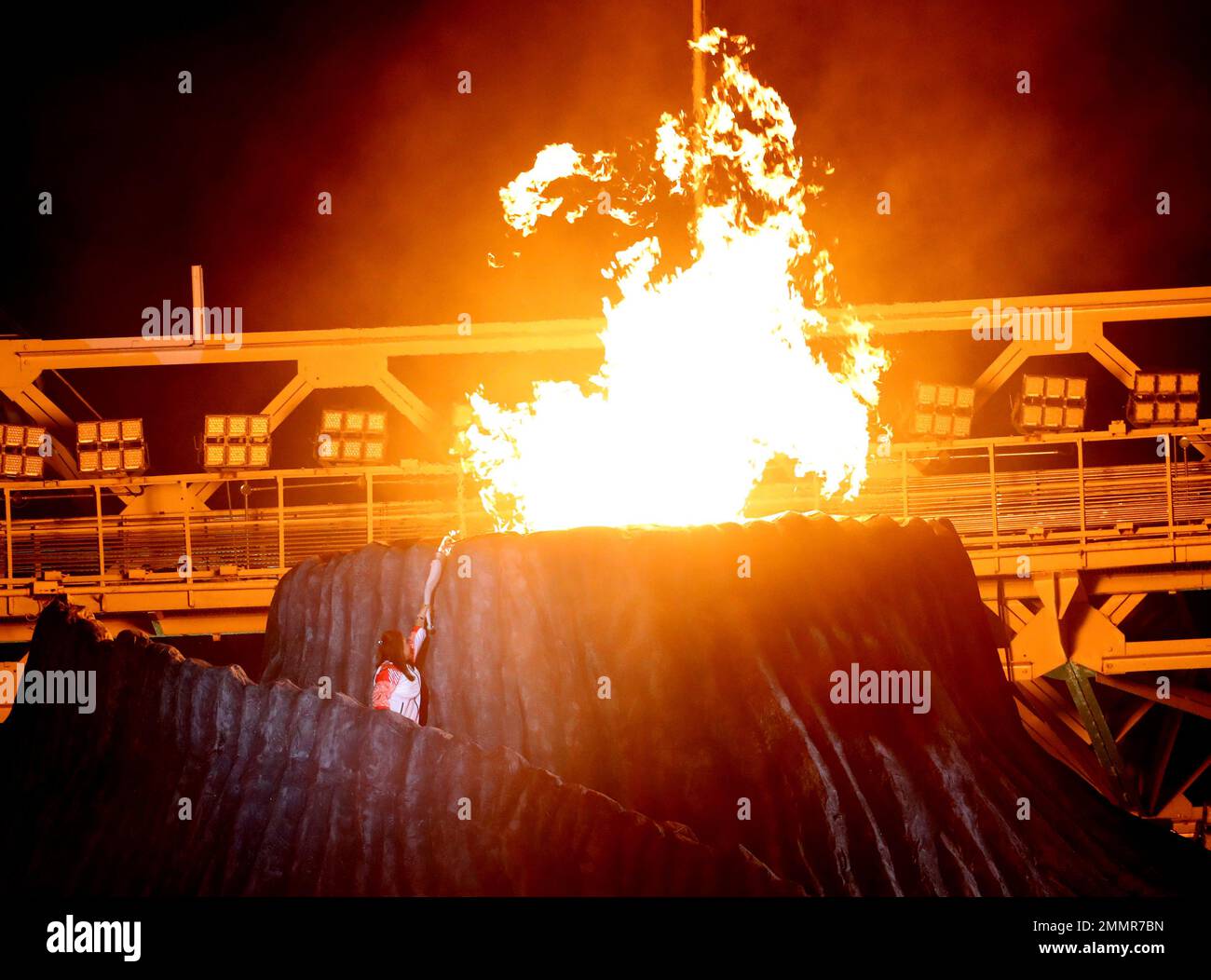 The cauldron is lit during the opening ceremony for the 18th Asian ...