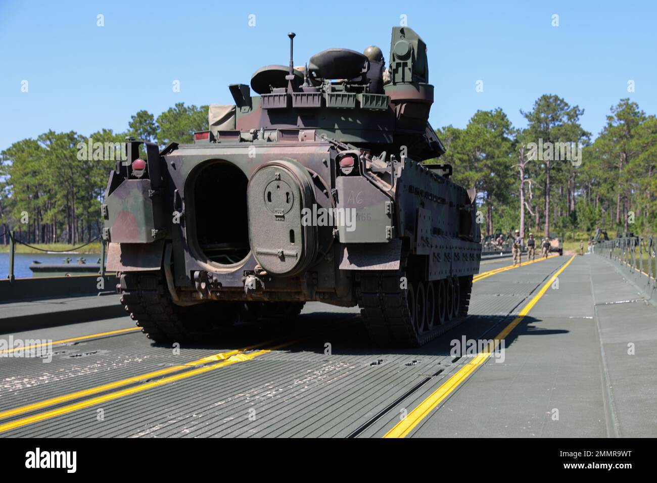 An M2A4 Bradley Fighting Vehicle crosses a bridge during a Wet Gap ...