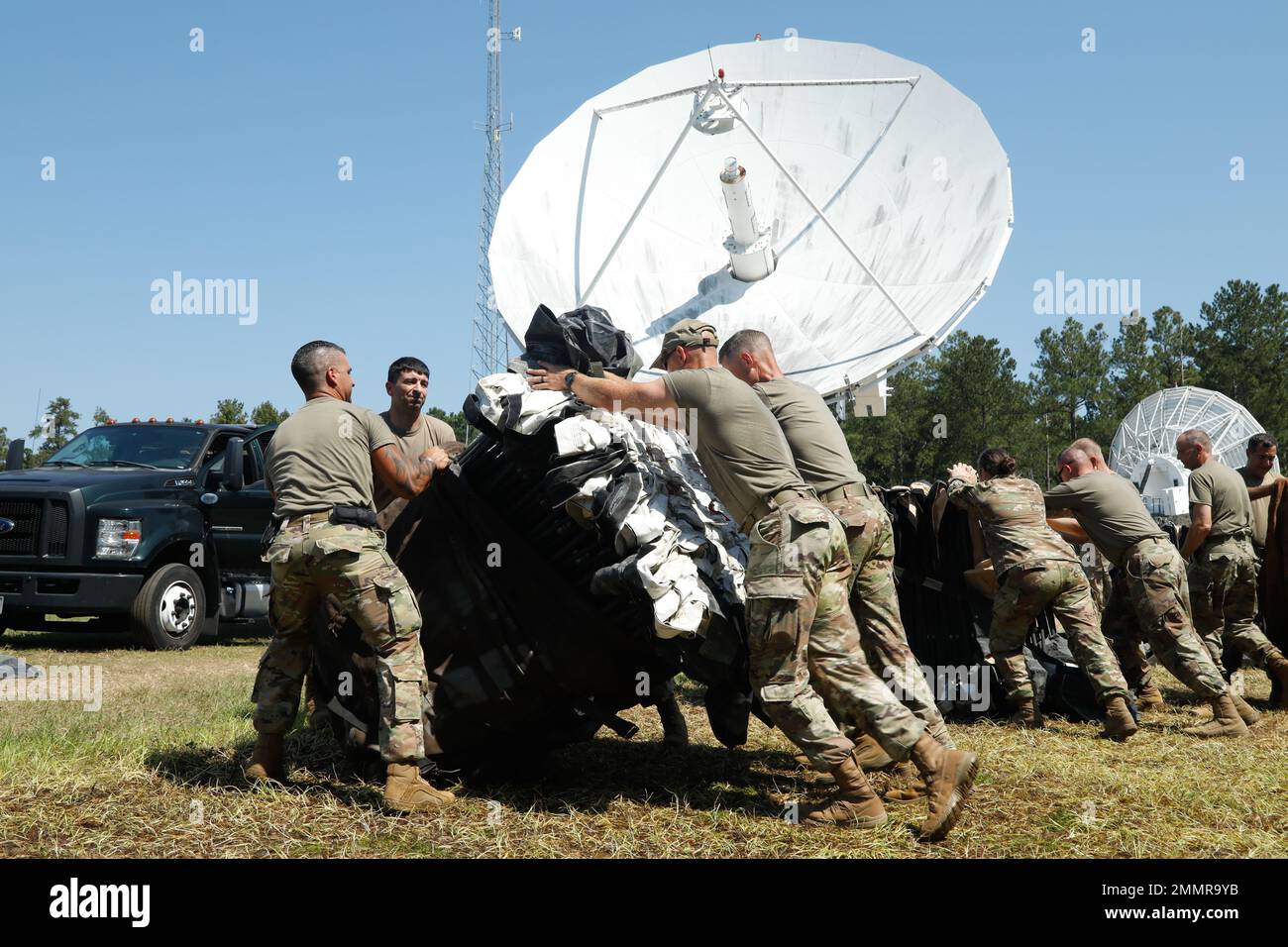 U.S. Army Central Soldiers work together to break down equipment after ...