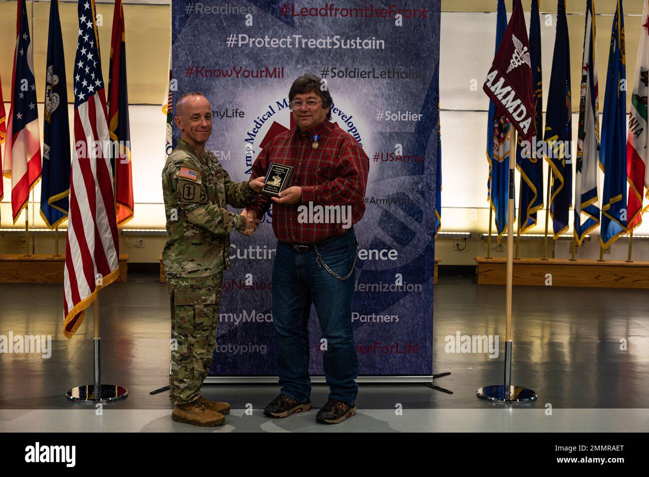 Col. Andy Nuce presents David Parry an Employee of the Quarter plaque ...