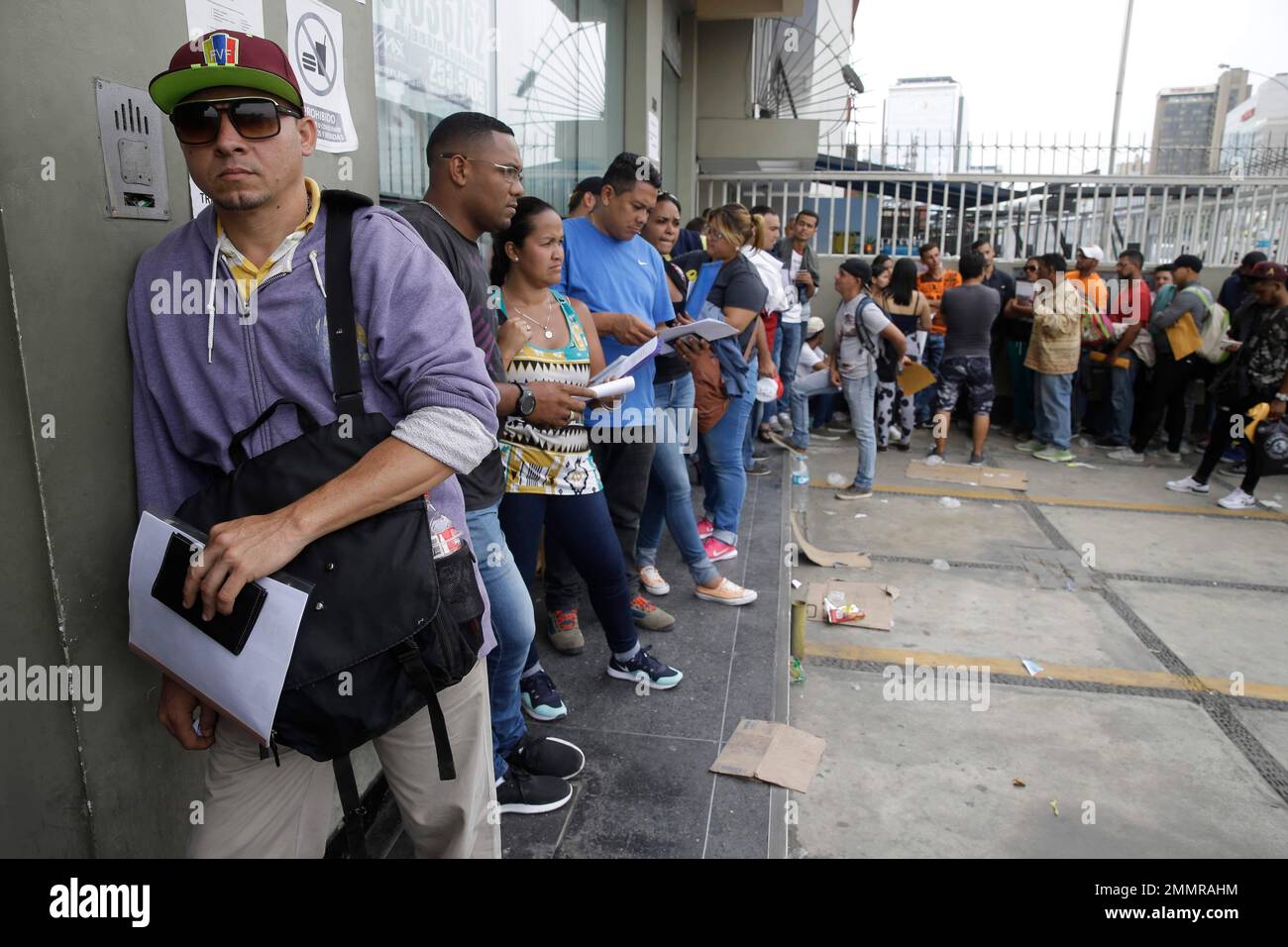 FILE - In this Jan. 23, 2018 file photo, Venezuelan citizens stand in a ...