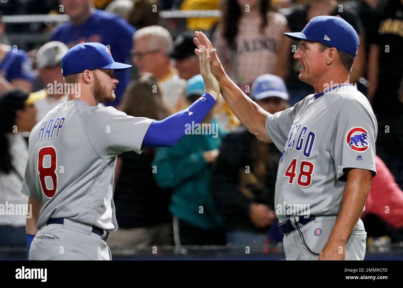 Chicago Cubs' Ian Happ (8) celbrates with Jim Hickey after defeating ...