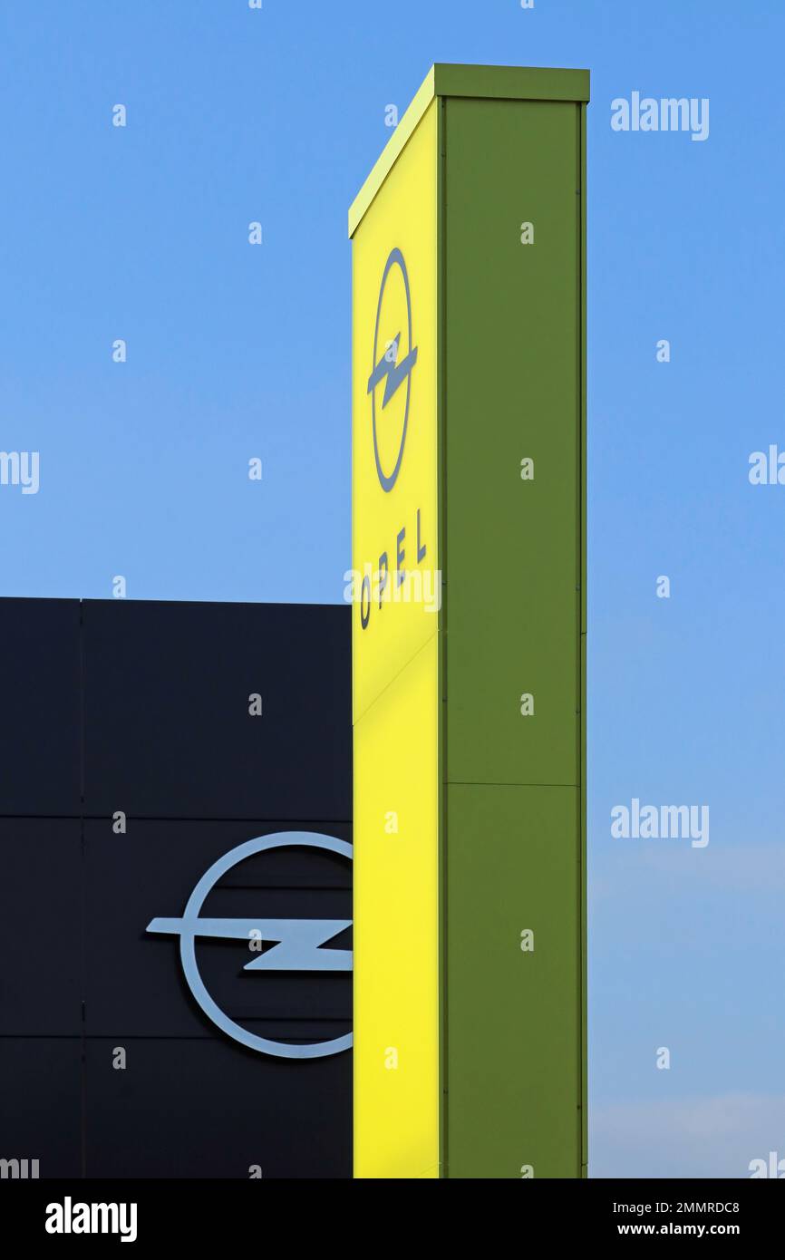 Italy, year 2023, illuminated street signs of an Opel dealer, a ...