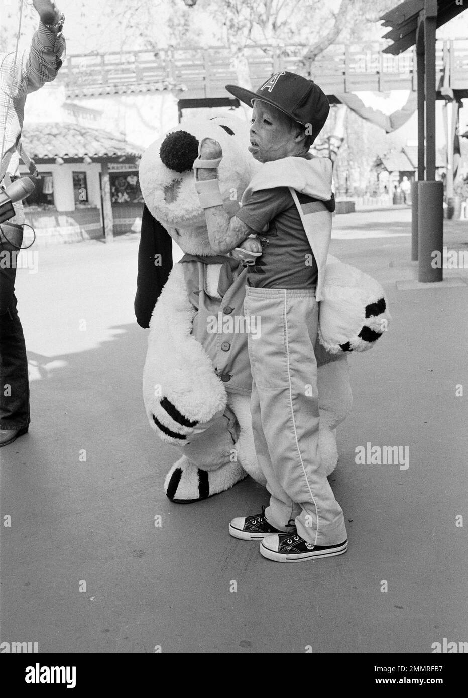Eight-year-old David Rothenberg pats the nose of Snoopy, Peanuts comic ...