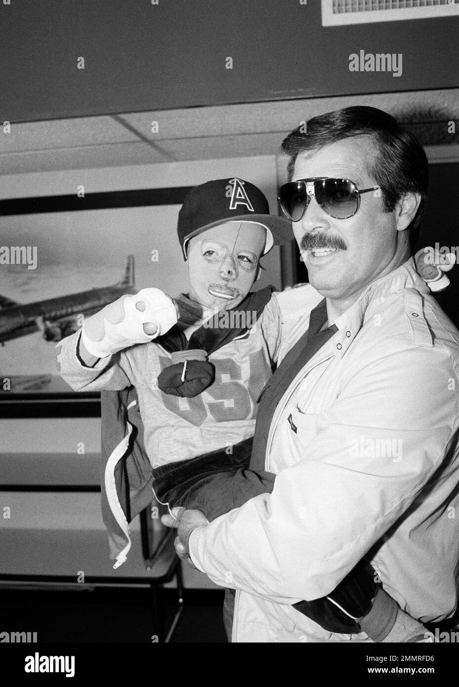 David Rothenberg, 7, waves goodbye from the arms of family friend Ken ...