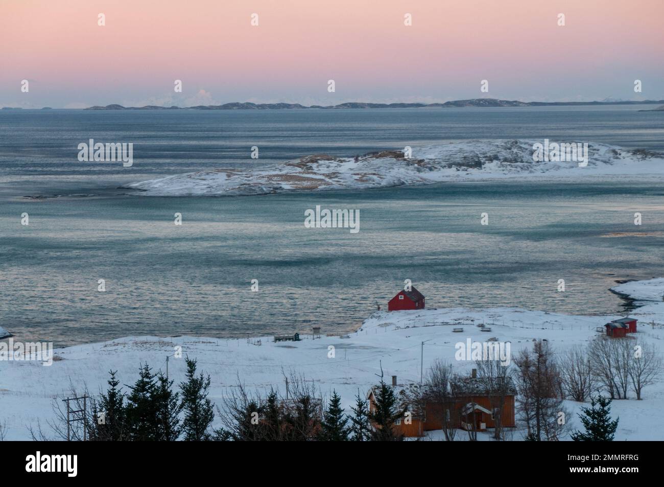 Overlooking the snow-covered beaches of arctic norway, near the town of ...
