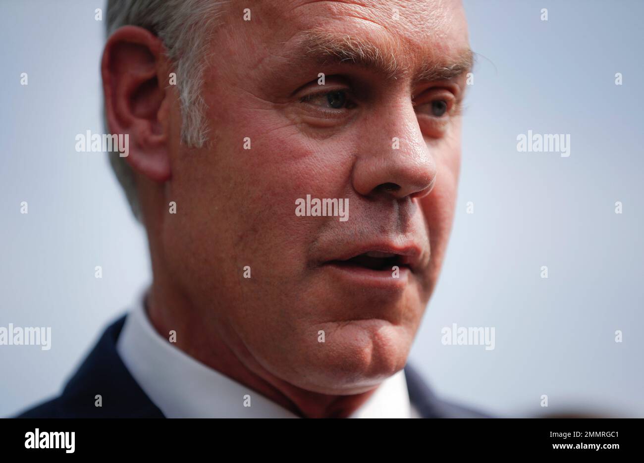 Interior Secretary Ryan Zinke speaks to members of the media outside ...