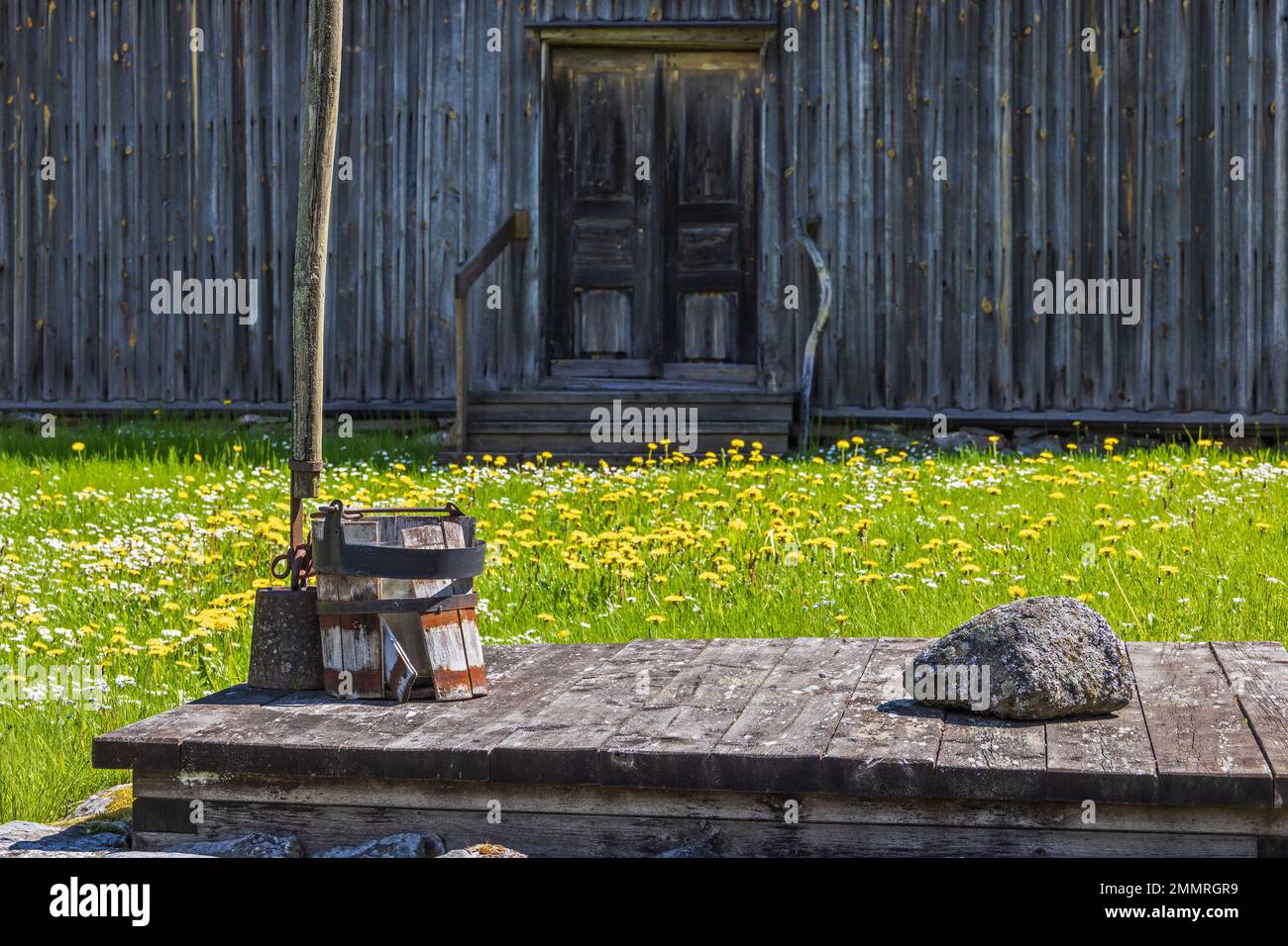 Old broken wooden bucket at a well Stock Photo - Alamy