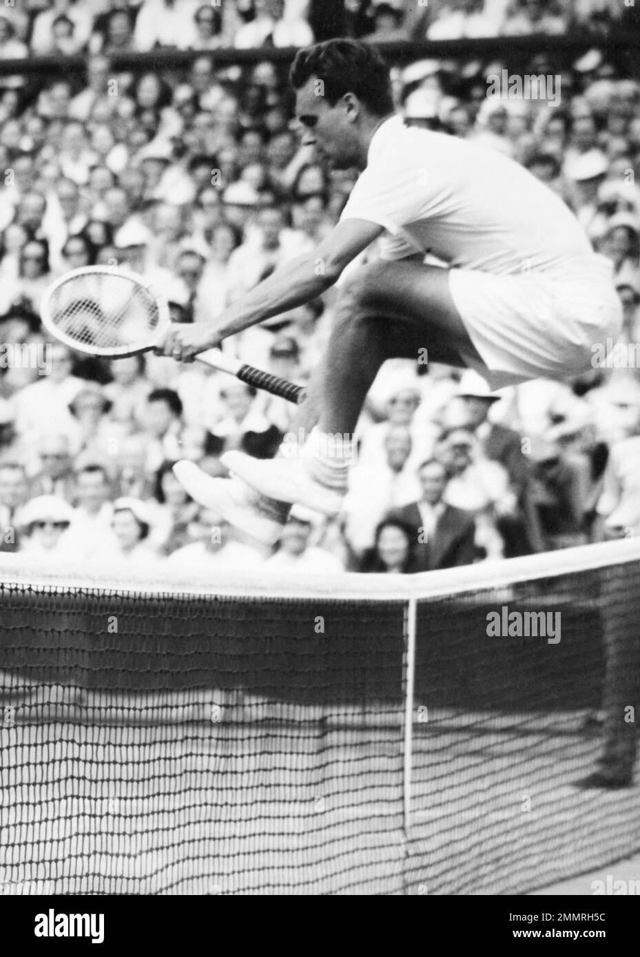Elias Victor Seixas Jr., known as Vic Seixas jumps the net to shake ...
