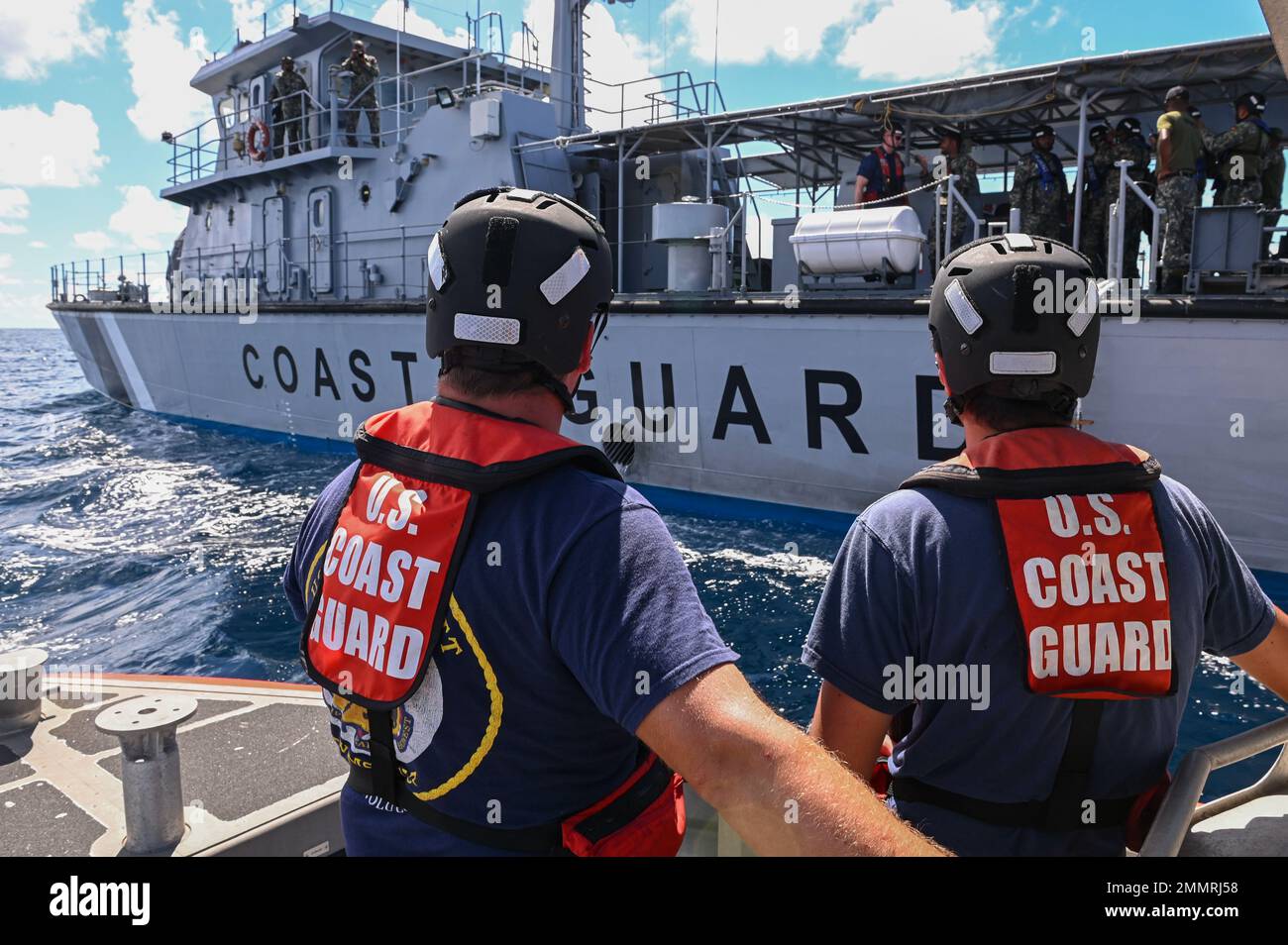 Crewmembers from U.S. Coast Guard Cutter Midgett (WMSL 757) stand ready ...
