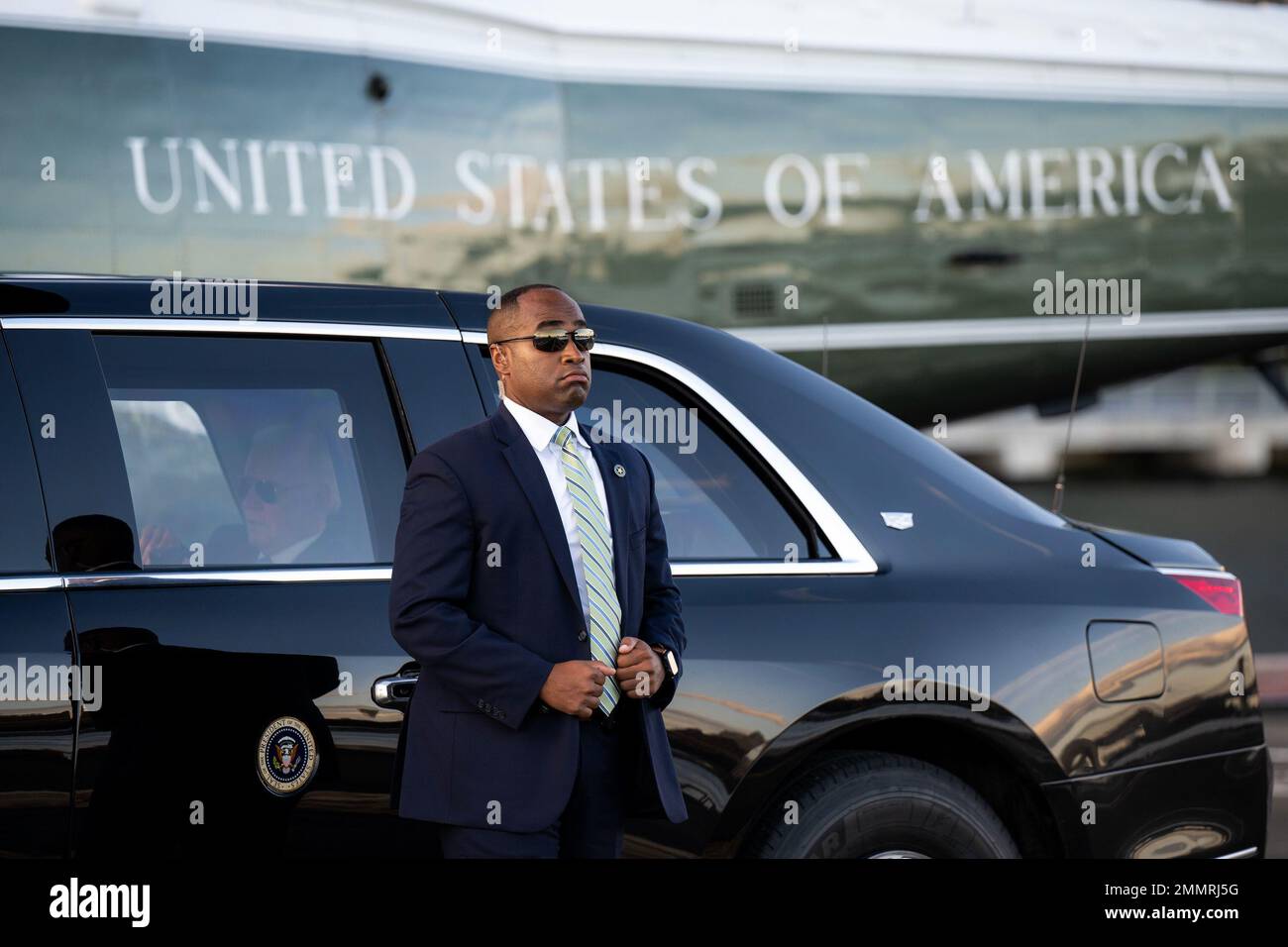 A U.S. Secret Service Agent provides security as the President of the ...