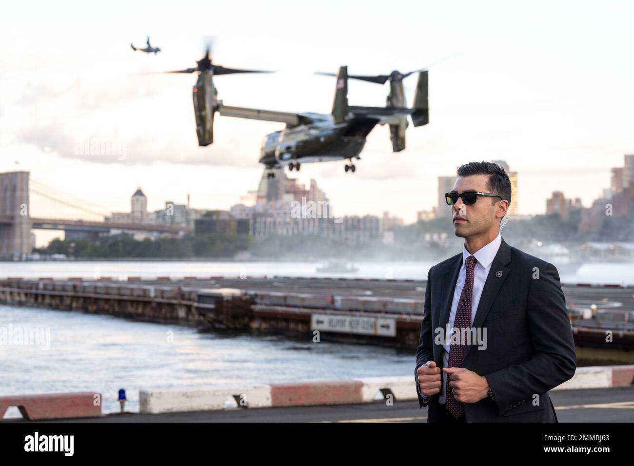 A U.S. Secret Service Agent provides security as the President of the ...