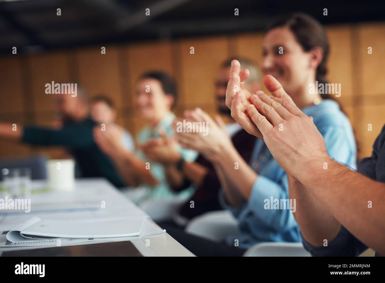 The creative process. a group of colleagues clapping together at a ...