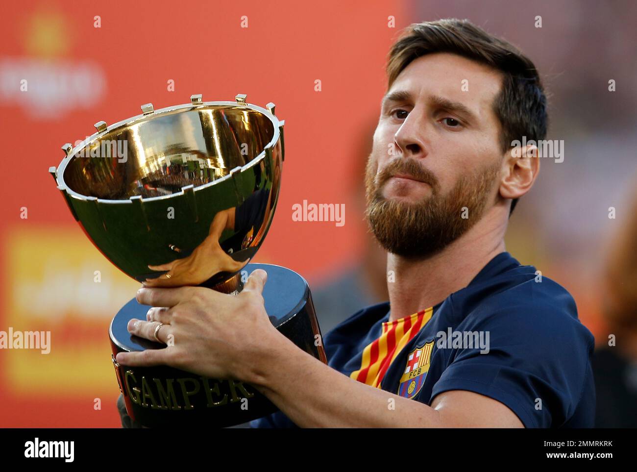 FC Barcelona's Lionel Messi holds up the Joan Gamper trophy after a ...