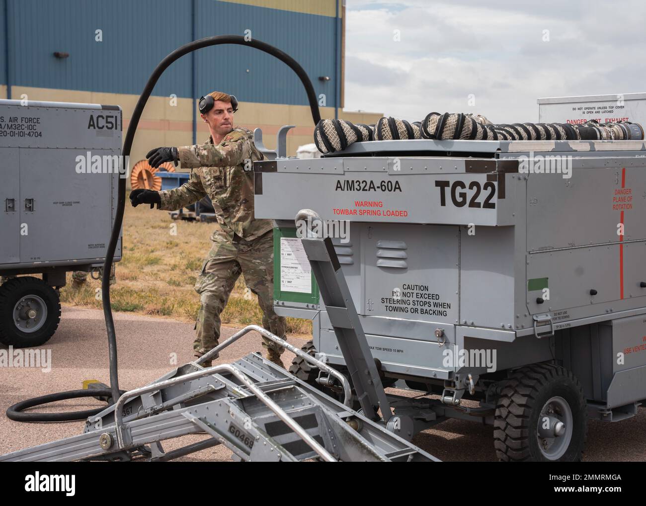 U.S. Air Force Tech. Sgt. Gregory Van Fossen prepares a generator for ...