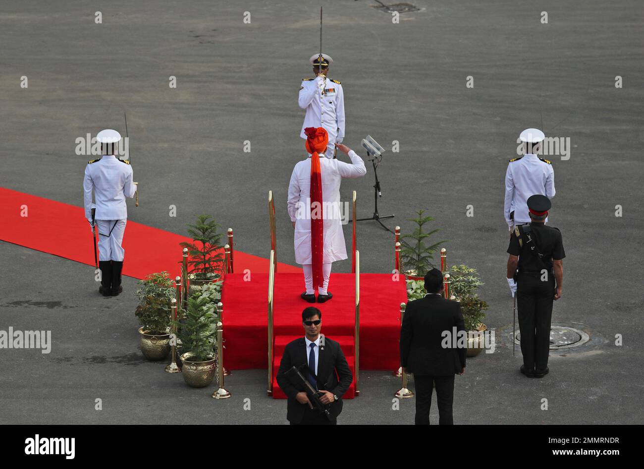 Indian Prime Minister Narendra Modi, center in orange turban, takes a ...