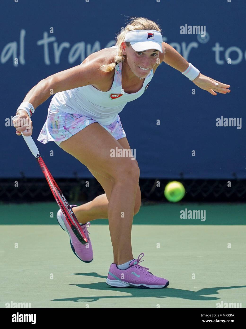 Timea Babos, of Hungary, returns to Amanda Anisimova at the Western ...