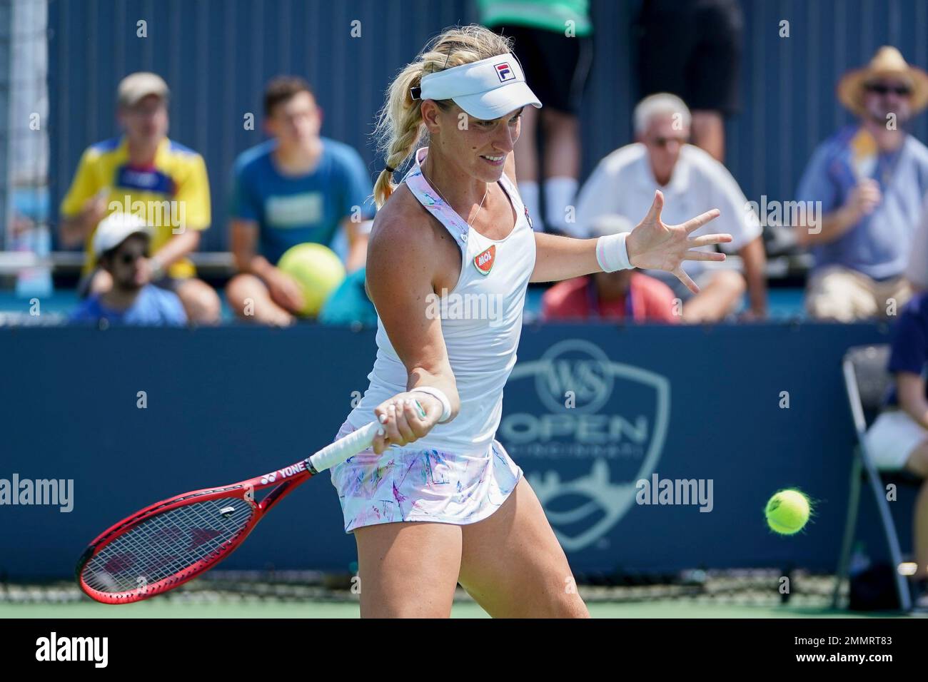 Timea Babos, of Hungary, serves to Amanda Anisimova at the Western ...