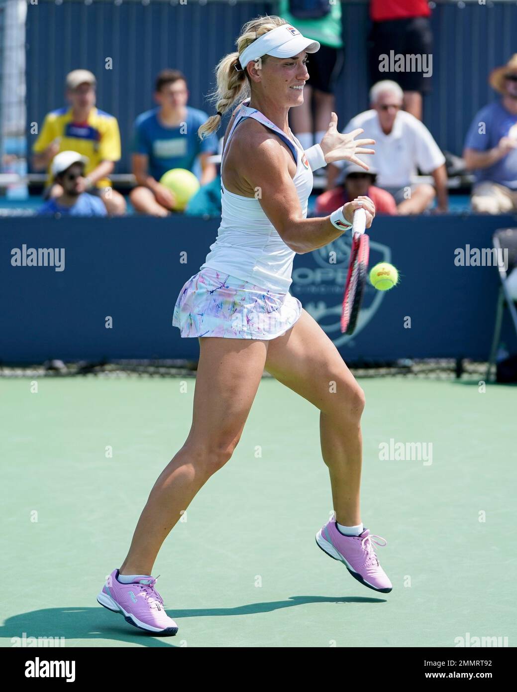 Timea Babos, of Hungary, serves to Amanda Anisimova at the Western ...