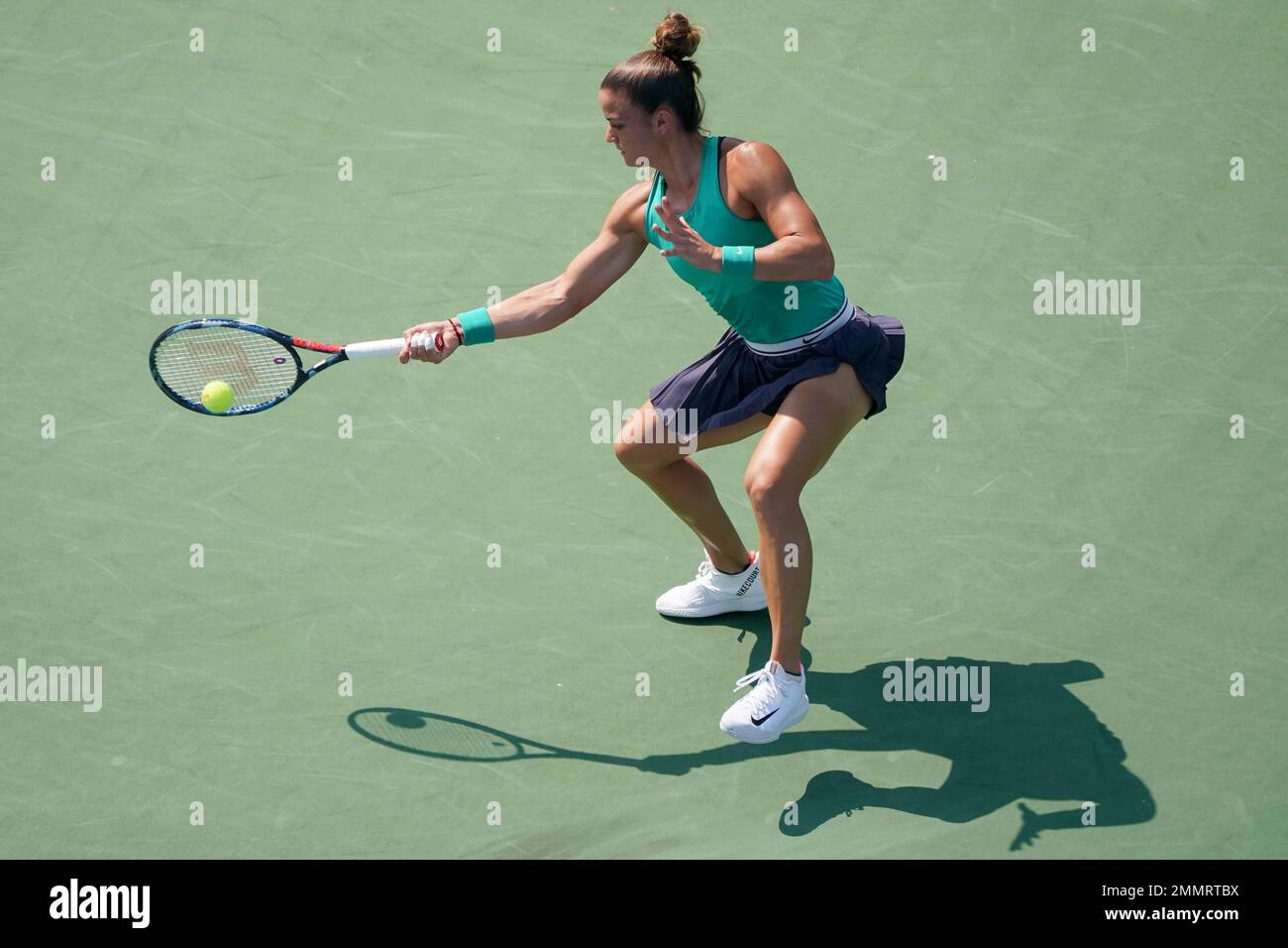 Maria Sakkari, of Greece, returns to Naomi Osaka, of Japan, at the ...