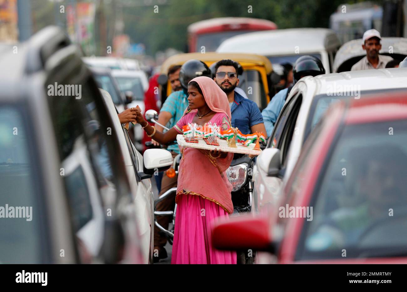 A woman sells Indian national flag memorabilia on the eve of ...