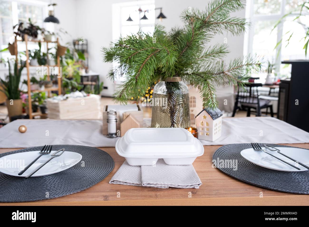 Food delivery service containers on table in white kitchen, festively ...